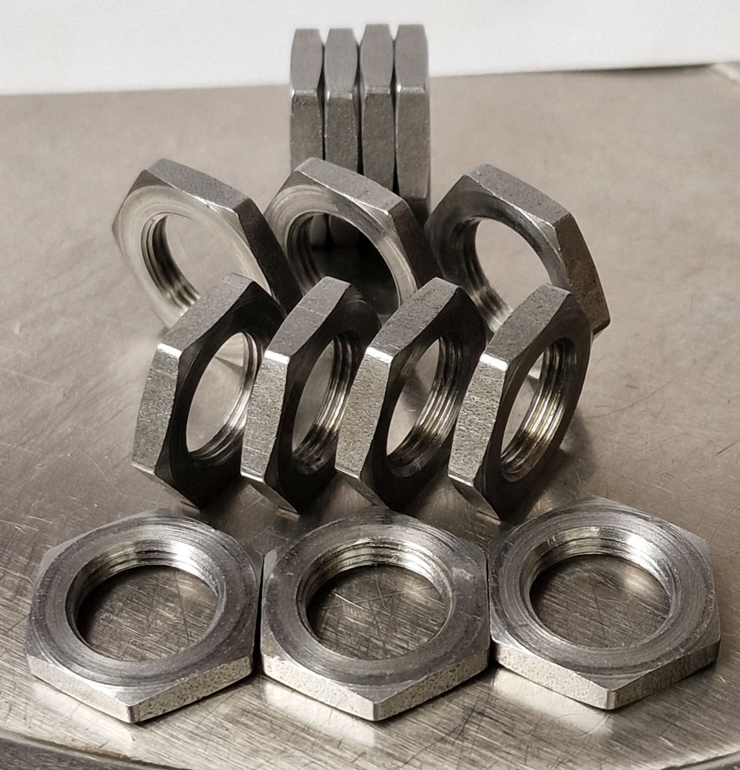 Internally threaded hex, square and round fasteners